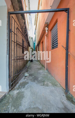 Corridor of Street Between Two Small Buildings Stock Photo - Alamy