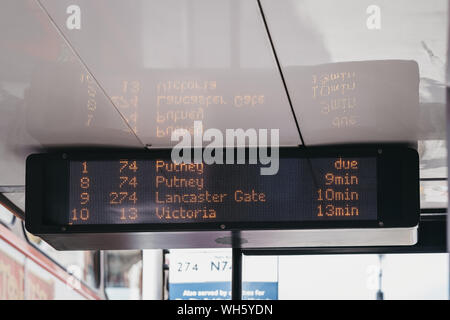Close up of a upcoming buses schedule on digital screen on a bus stop ...