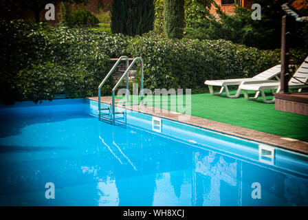 private pool with perimeter stones and steps Stock Photo - Alamy