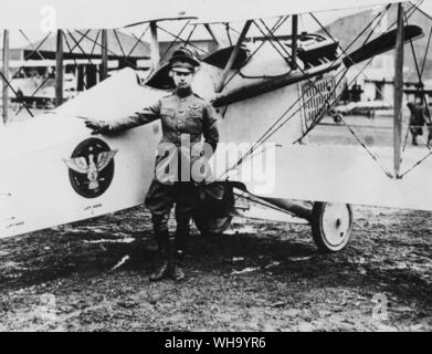 Brigadier General Billy Mitchell, in aviator's clothes, standing beside ...