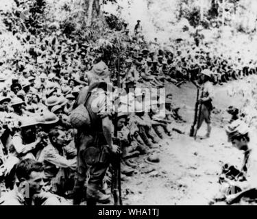 On the Bataan Death March these prisoners have their hands tied behind ...