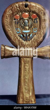 Ankh, an ancient Egyptian symbol of life, in ahand of a god on the wall ...