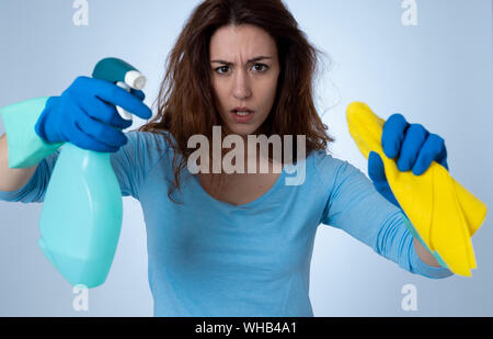 woman upset with cleaning products Stock Photo - Alamy