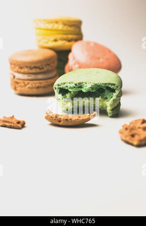 Assorted macaroons cookies tower with copy space on blue background ...