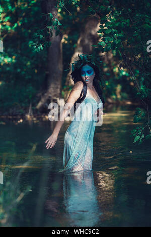 Young drown woman in a poetic representation. The concept of the undead ...