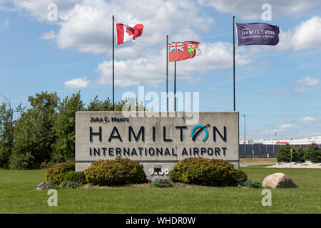 Sign at the entrance to John C. Munro Hamilton International Airport ...