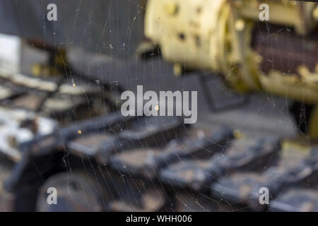 Spider web and belt of mining machine Stock Photo - Alamy