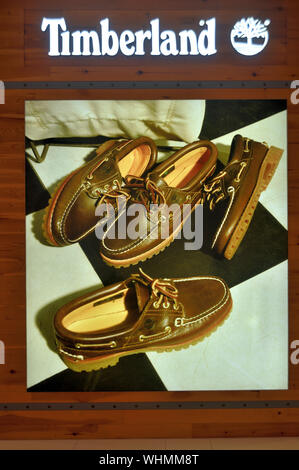Timberland shoes on display in shop window Stock Photo - Alamy