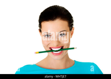 Woman with pencil in her mouth Stock Photo: 11575201 - Alamy