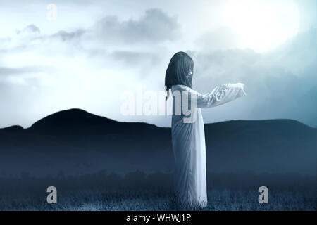 Female ghost with blood on hand seen through window of haunted cabin ...