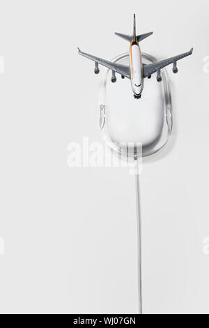 Jumbo jet on apple macintosh computer mouse, digital composite Stock ...