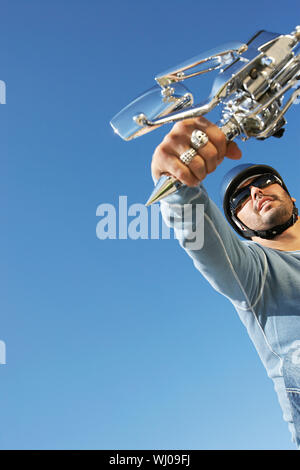 Biker riding motorcycle, low angle view Stock Photo - Alamy