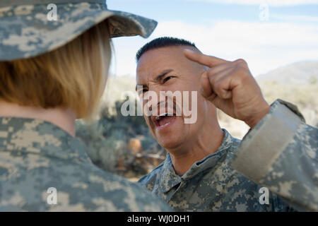 Commander yelling at female soldier Stock Photo - Alamy