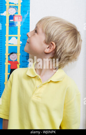 Boy Getting Height Measured Stock Photo - Alamy