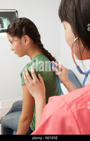 Teen girl and doctor hand with stethoscope listening to heartbeat Stock ...