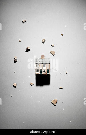 Smashed model house Stock Photo - Alamy