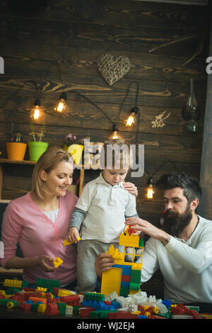 Mom and child build out of colorful plastic blocks Stock Photo - Alamy
