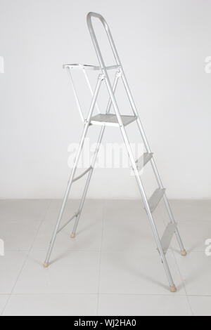 Empty foldable step ladder Stock Photo - Alamy