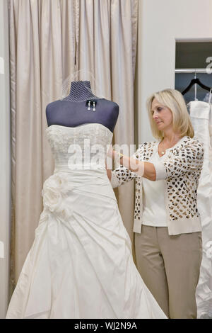 Female Owner Of Bridal Wedding Dress Shop With Digital Tablet Stock ...