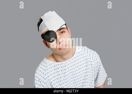 Male patient wearing an eye patch suffering from head injury Stock ...