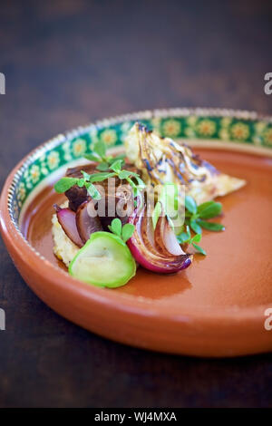 Close up gourmet grilled shallot and beef appetizer Stock Photo - Alamy