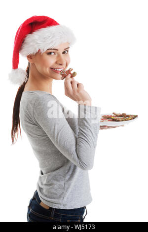 Attractive young woman with a beautiful gingerbread on a walk Stock ...