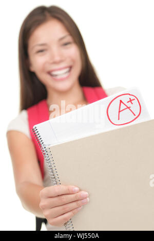 A plus (A+) grade on notebook paper sheet with math operation solved ...