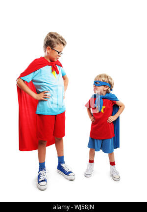 Portrait of a team of two young superheroes, brother and sister, over ...