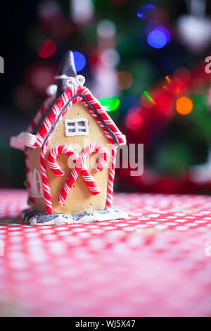 Close-up Gingerbread fairy house decorated by colorful candies on a ...