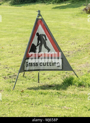 Work in progress warning sign text with yellow and black stripes ...