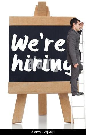 Composite image of stern businessman standing with hands on hips Stock ...