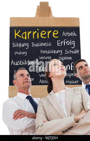 Composite image of serious work team posing together looking away Stock ...