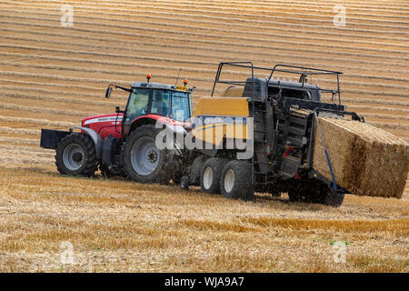 Hay Baler - farm machinery used to compress a cut and raked crop (such ...