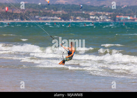 Tricks of professional kitesurfing athletes Stock Photo - Alamy