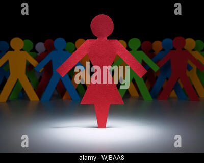 A female paper figure stands under the spotlight in front of multicolor ...