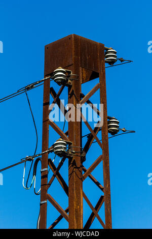 Old rusty top of an electrical tower Stock Photo - Alamy