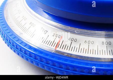blue kitchen scales or balance showing cooking concept Stock Photo - Alamy