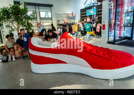 Shoppers and visitors flock to the newly opened Puma flagship store on ...