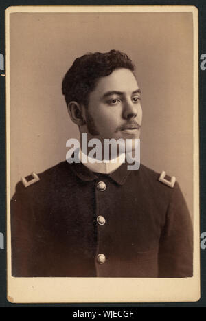 Portrait of a man in a military uniform, standing. Part of photo album ...