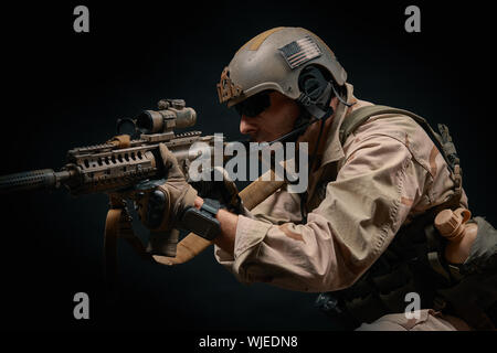 Security man wearing black uniform and yellow reflective vest standing ...