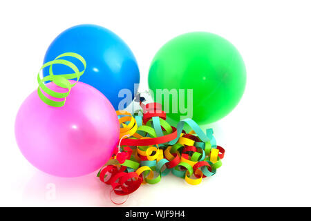 colorful balloons and paper chains streamers isolated over white Stock ...