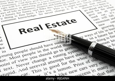 Houses for sale ads in newspaper, London, England, UK Stock Photo - Alamy