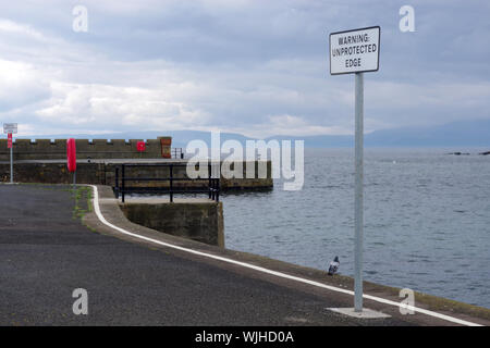 Unprotected edge warning sign at harbour port for car and vehicle ...