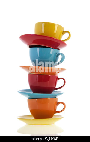 Stacked cups and saucers isolated over white background Stock Photo - Alamy