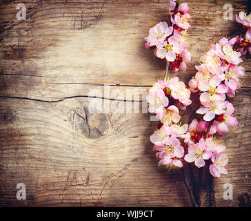 Blooming cherry twig over old wooden table Stock Photo - Alamy