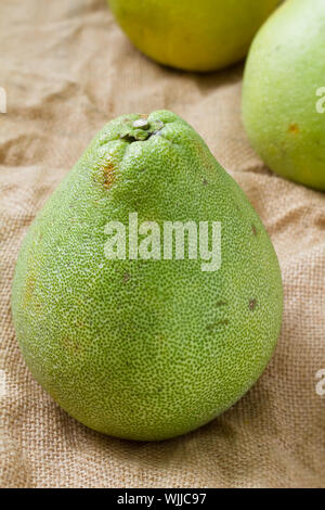 Pompelmous on desk, fresh fruit look like grapefruit Stock Photo - Alamy