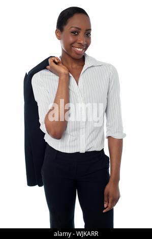Businesswoman with coat slung over her shoulder Stock Photo - Alamy