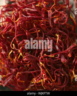 Saffron, appreciated red spice in vivid red orange color macro texture ...