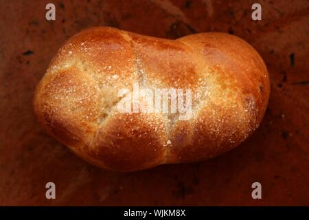 One brioche pastrie close up, brown clay background, macro bakery Stock ...