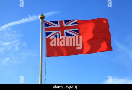 A Merchant Navy Red Ensign flag seen against the blue sea on the ...
